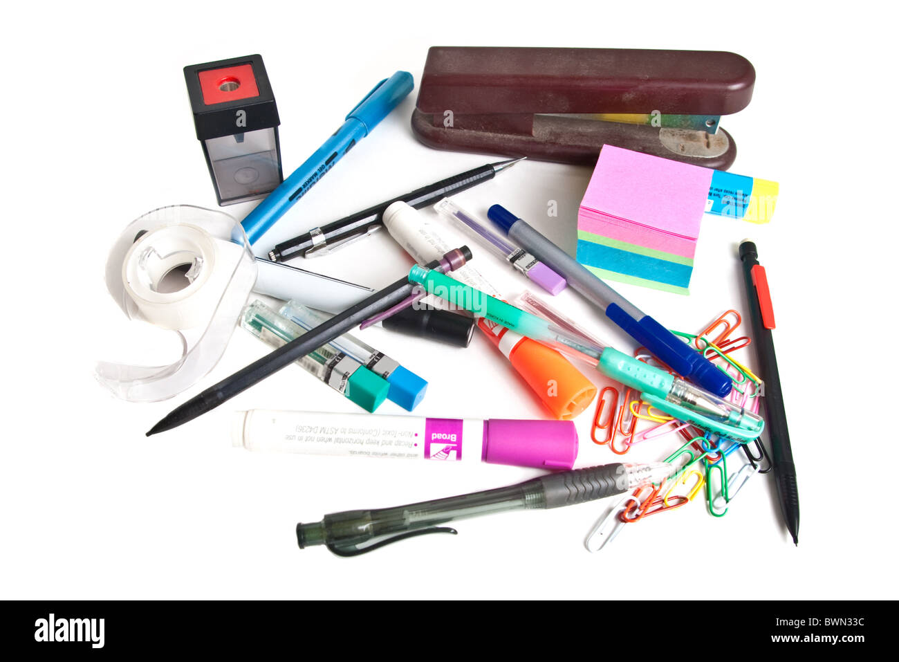 Grouping of misc. office supplies on a white background Stock Photo - Alamy