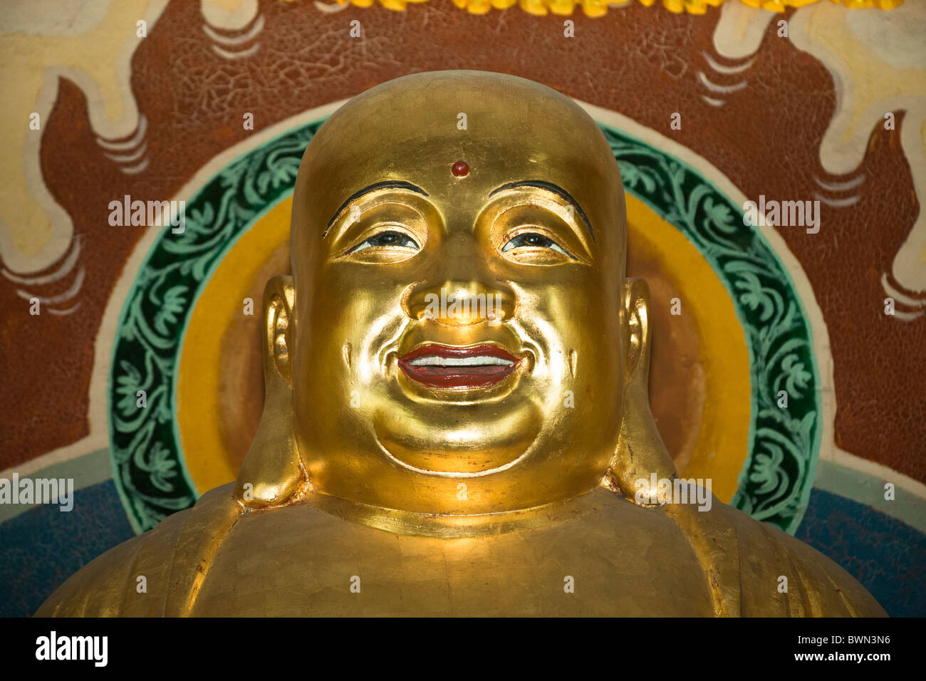 Face of smiling golden Buddha, Wenshu Temple, Chengdu, Sichuan Province ...
