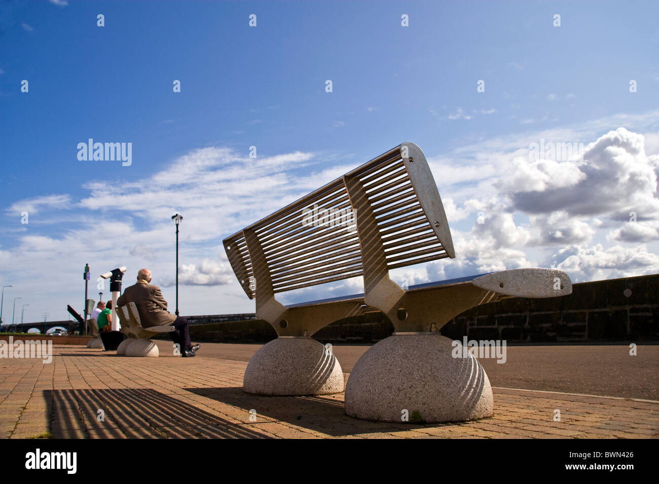 Stainless steel bench along the Riverside promenade on the waterfront ...