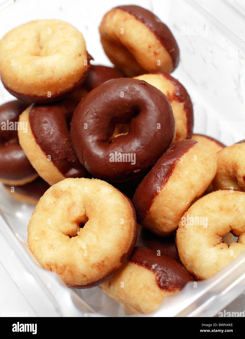 A Box of mini chocolate donuts Stock Photo - Alamy