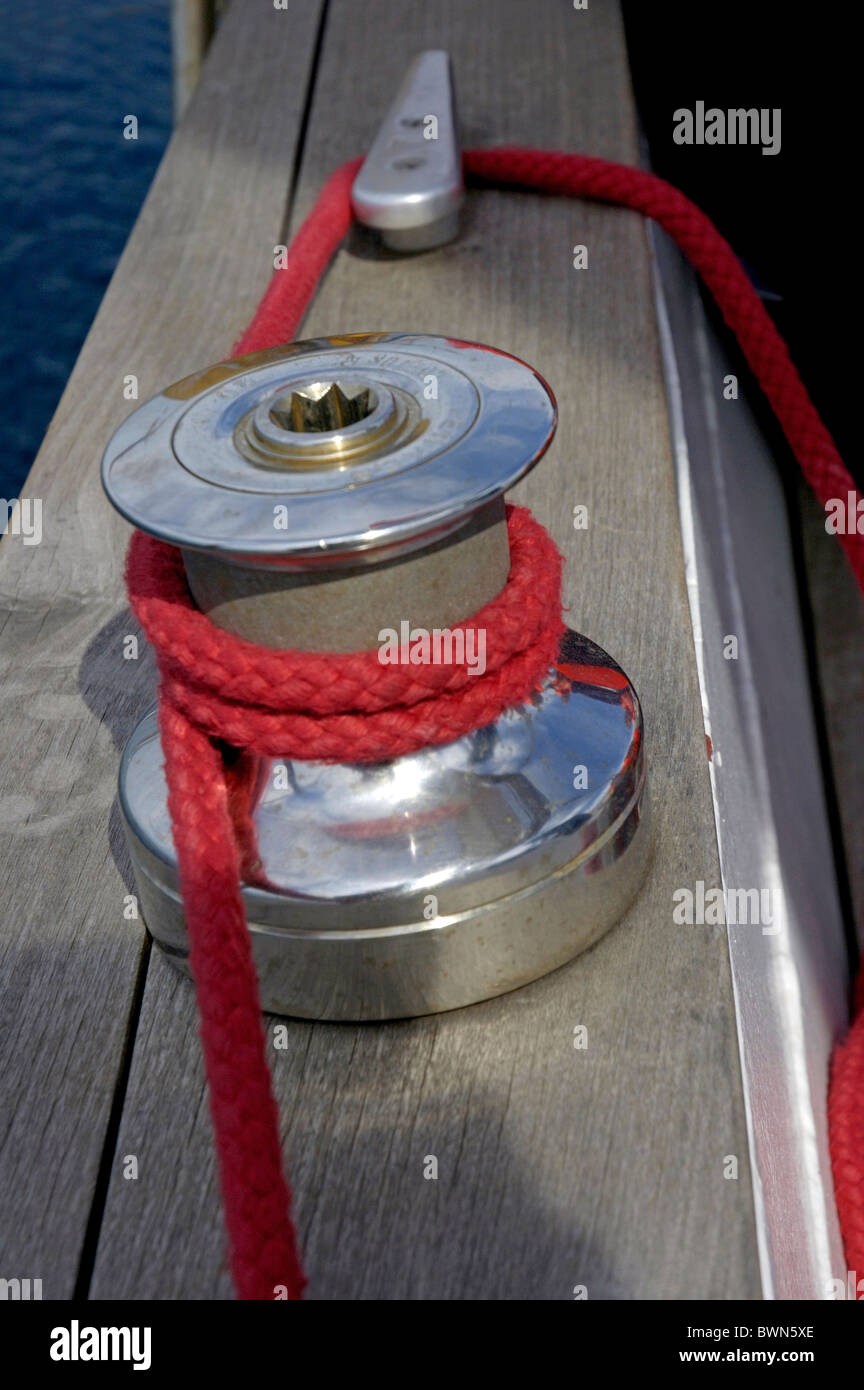 Red rope and winch on a sailboat Stock Photo - Alamy