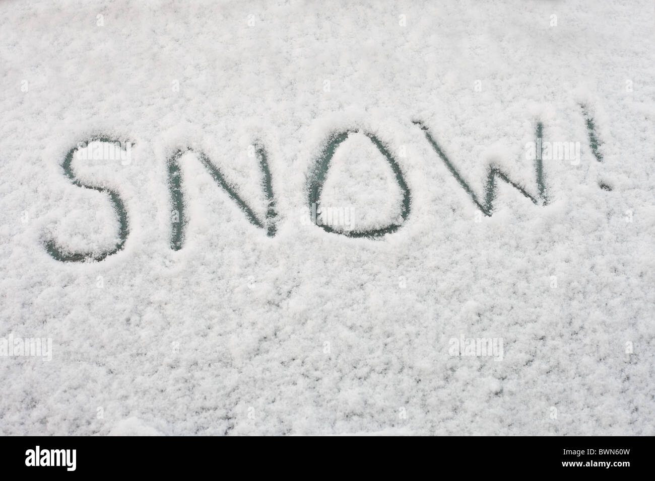The word snow! written in snow on a car window Stock Photo - Alamy