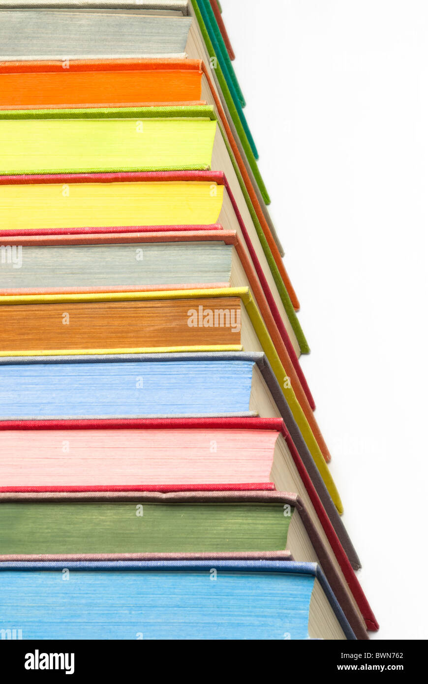 Stack of colored hard covered used books Stock Photo - Alamy