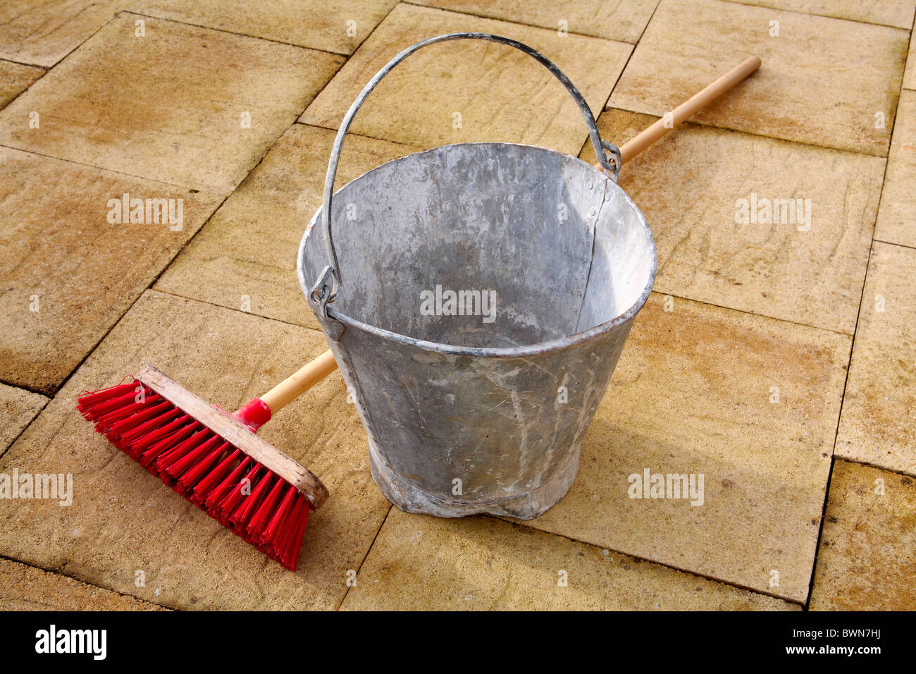 Empty Builders Metal Bucket and plastic bristled headed broom Stock ...