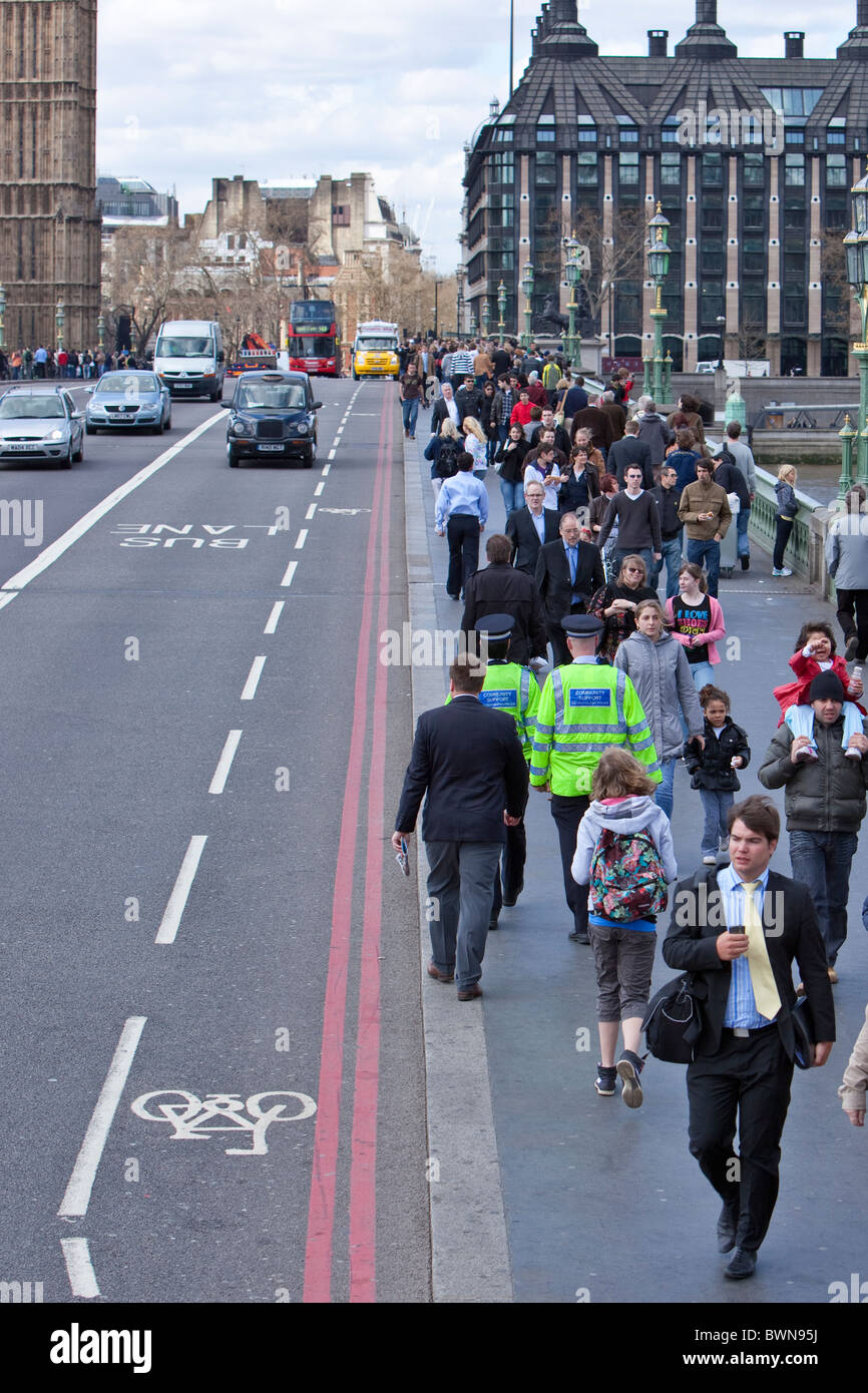 Pedestrians crossing Westminster bridge (Including two PCSO Police ...