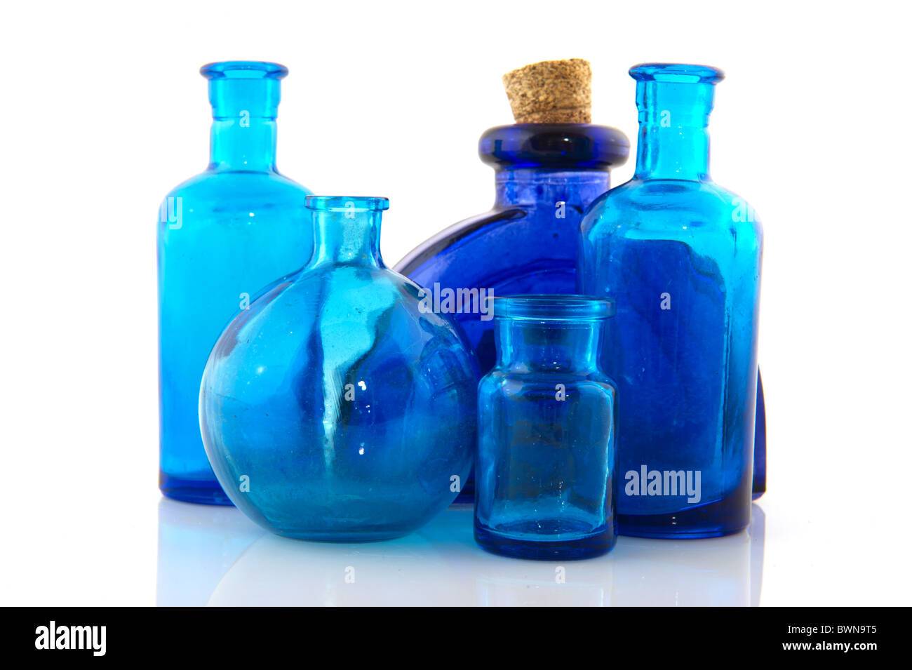 Several blue glass objects in a row isolated over white Stock Photo - Alamy