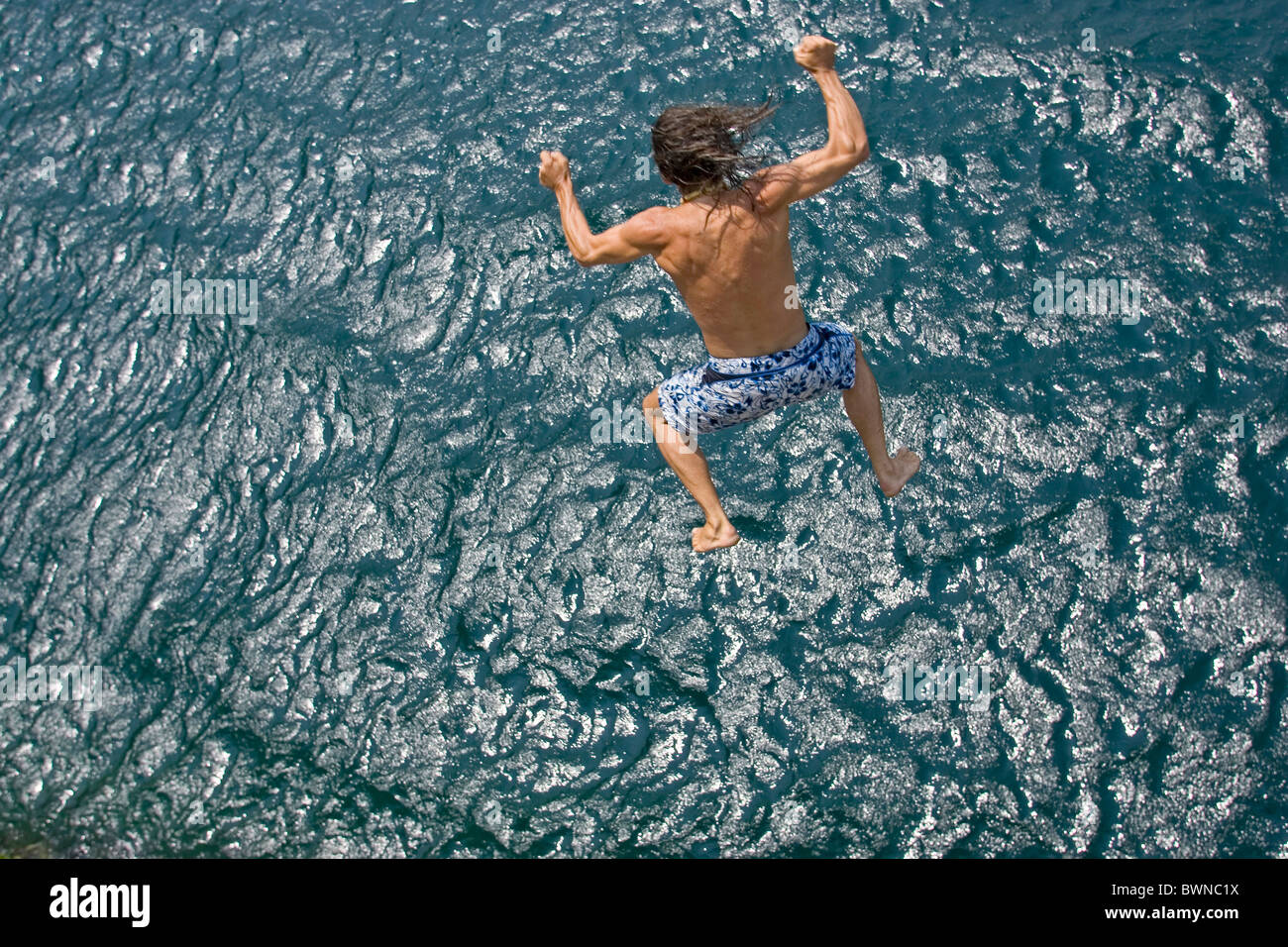 Man jumping into lake garda hi-res stock photography and images - Alamy
