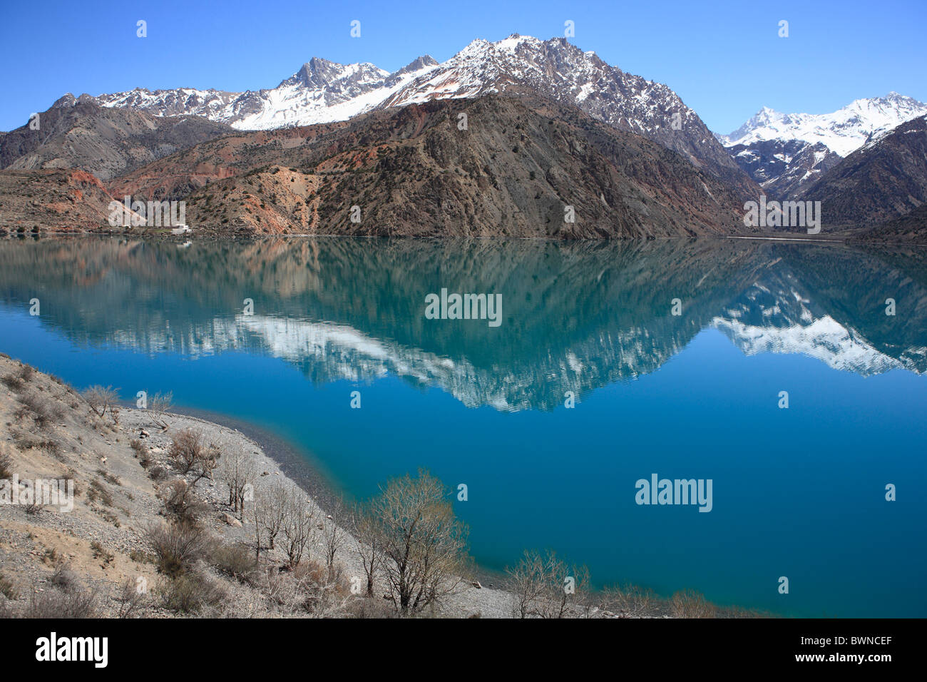 Tajikistan Central Asia blue sky Iskanderkul lake Fan mountain water ...