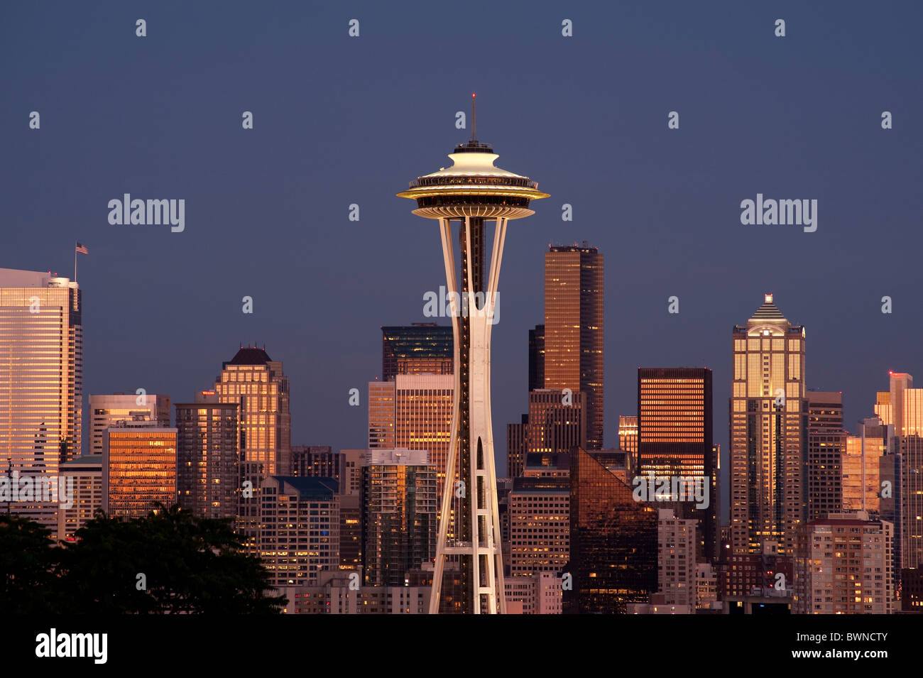 Retro image of Seattle skyline at sunset downtown with city lights ...