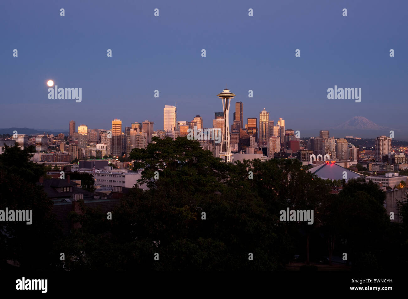 Retro image of Seattle skyline at sunset with Mount Rainier with moon ...