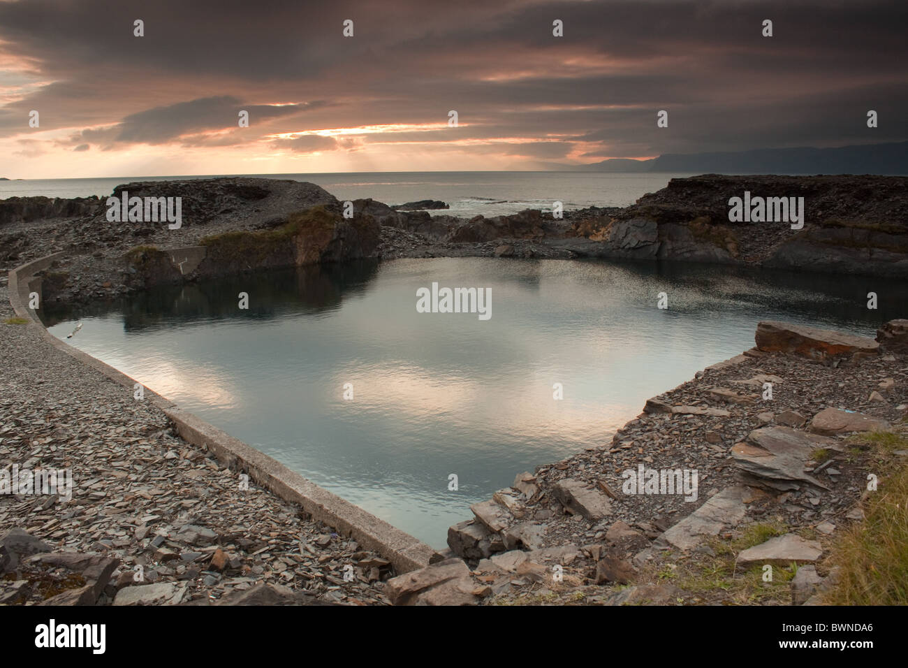 One of the old slate quarries at dusk on Easdale Island off the Argyll ...