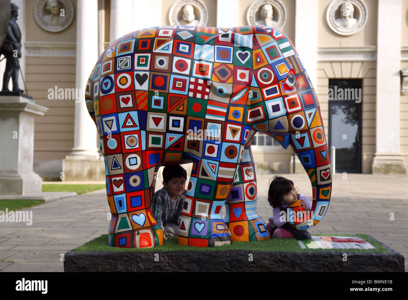 BOY & GIRL PEEPING ROUND MULTI-COLOURED ELEPHANT GREENWICH LONDON ...