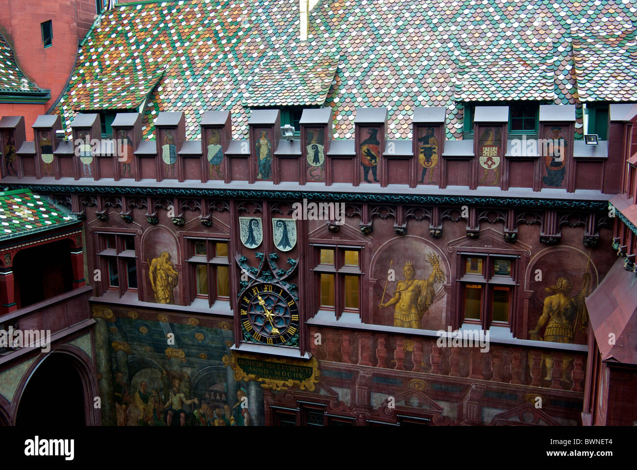 Historic Rathaus red city hall building with multi-colour tile roof on ...
