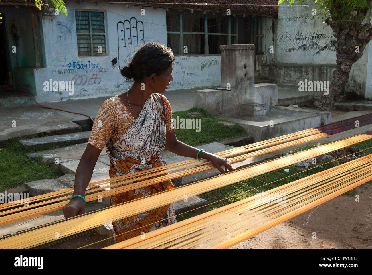 Removing knots and drying silk yarn ;old tradition practiced by weavers ...