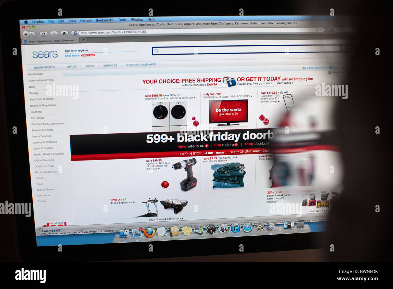 A shopper looks at the e-commerce website of Sears displaying their ...