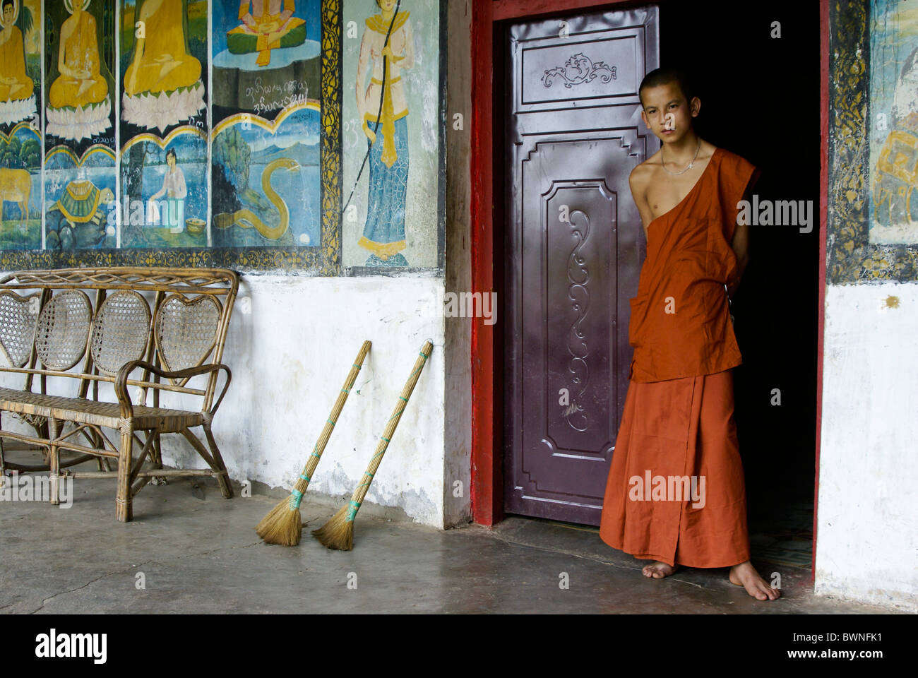 Buddhist monk at monastery, Jingzhen, Xishuangbanna, Yunnan, China ...