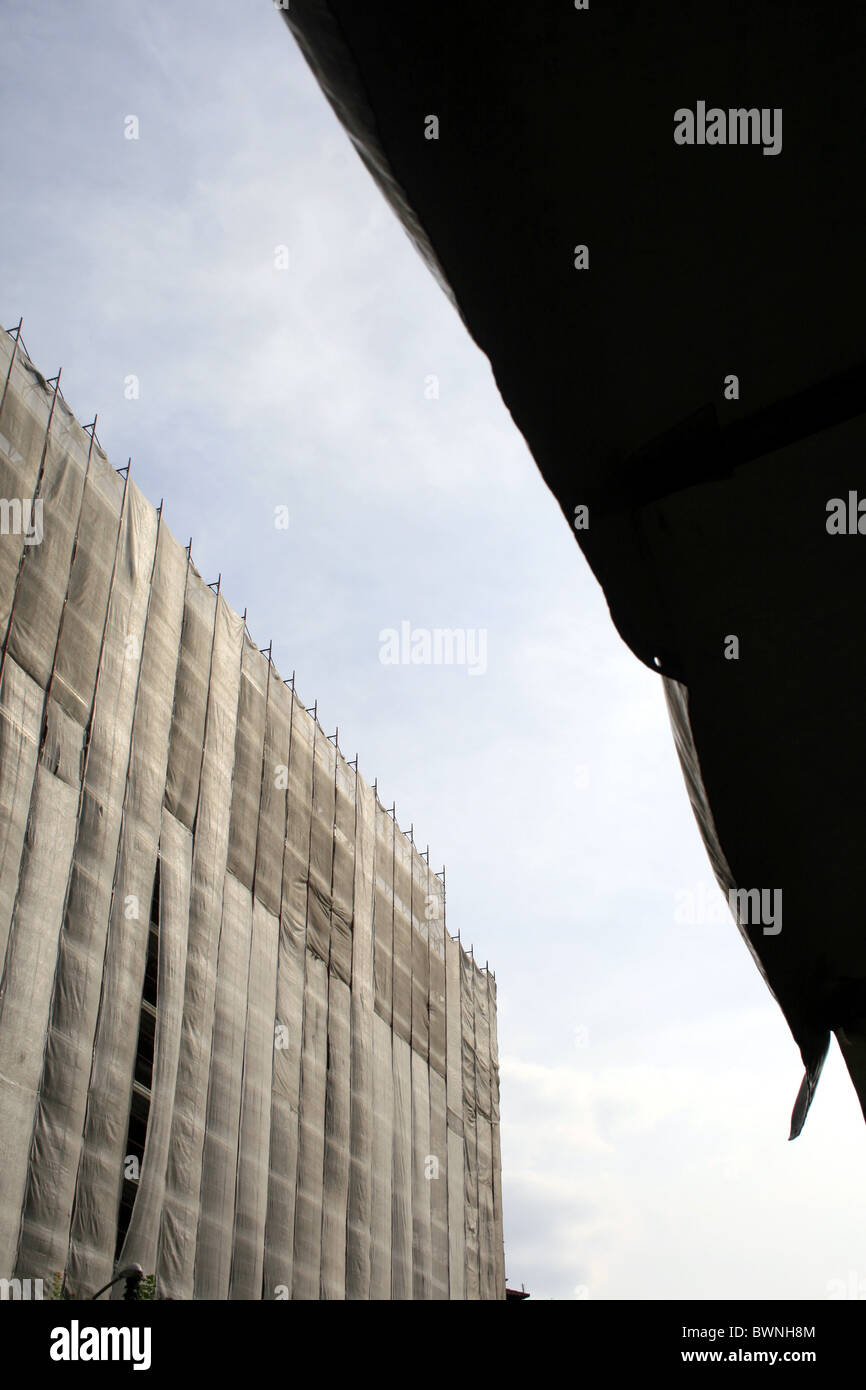 protective mesh cover on building being renovated Stock Photo - Alamy