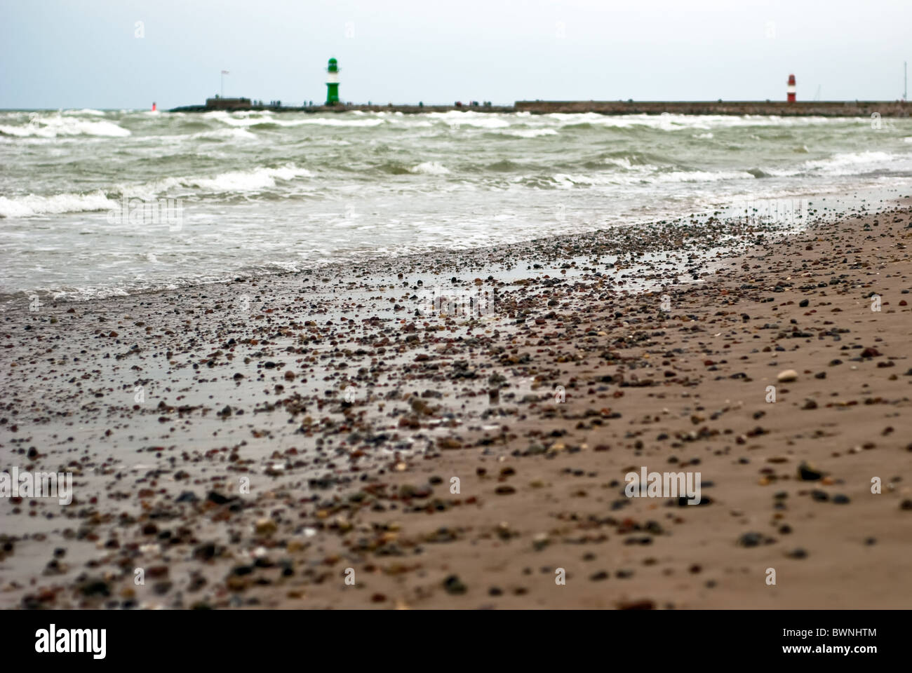 Sandy beach with two lighthouses in the background Stock Photo - Alamy