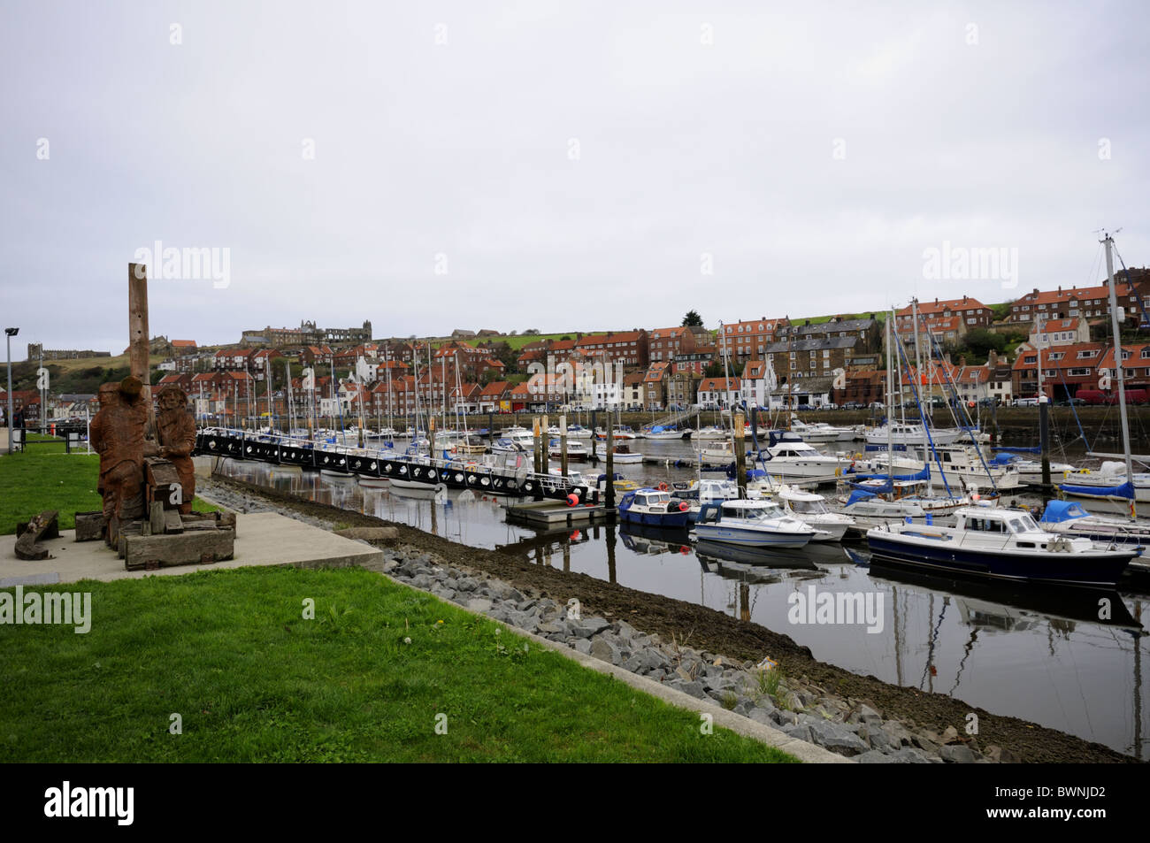 Carved Wooden Statue next to Whitby Harbour in North Yorkshire Stock ...