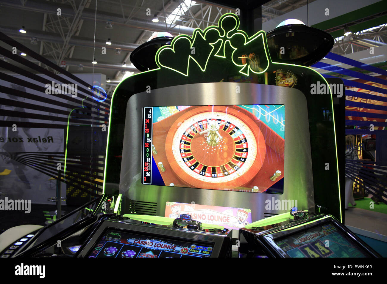row of one arm bandits at trade fair Stock Photo - Alamy