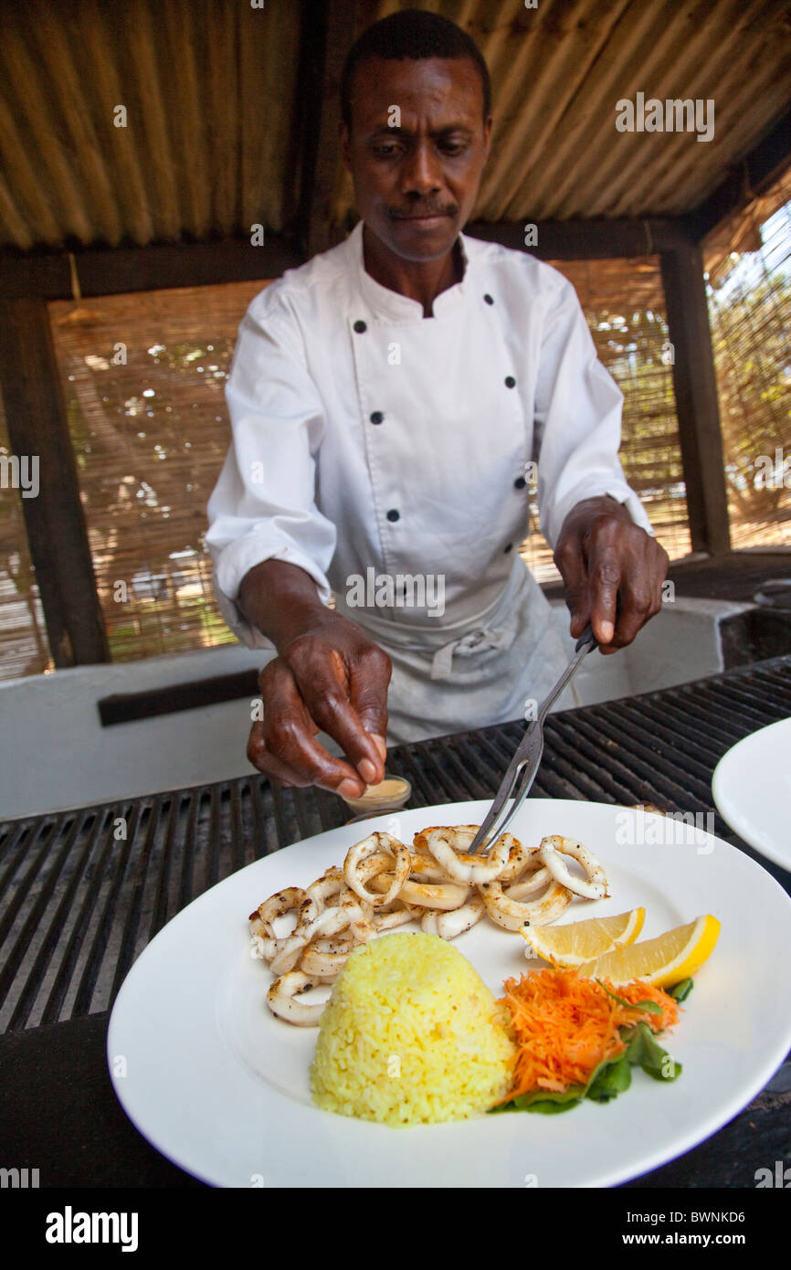 Grilling seafood at a Old Man and the Sea restaurant in Mombasa, Kenya ...