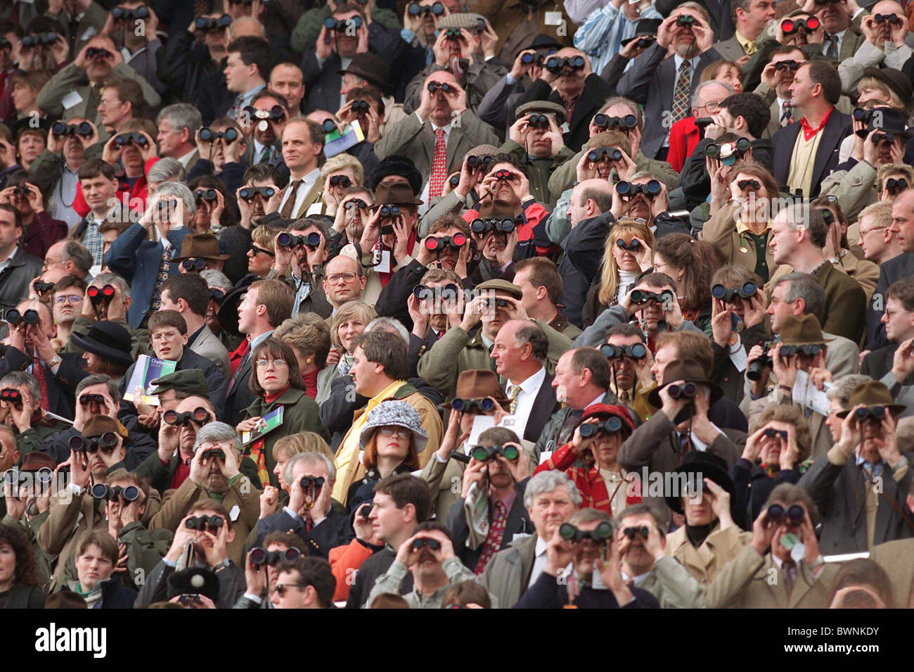 Large crowd scene scenes using binoculars crowded watching observing hi ...