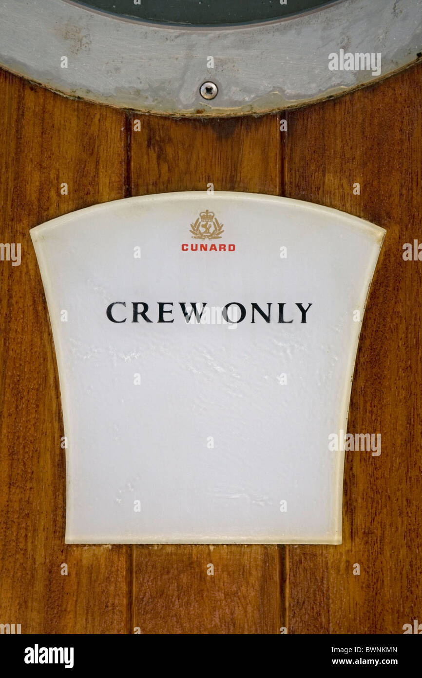 Sign for crew only entry on the Queen Mary 2 Stock Photo - Alamy