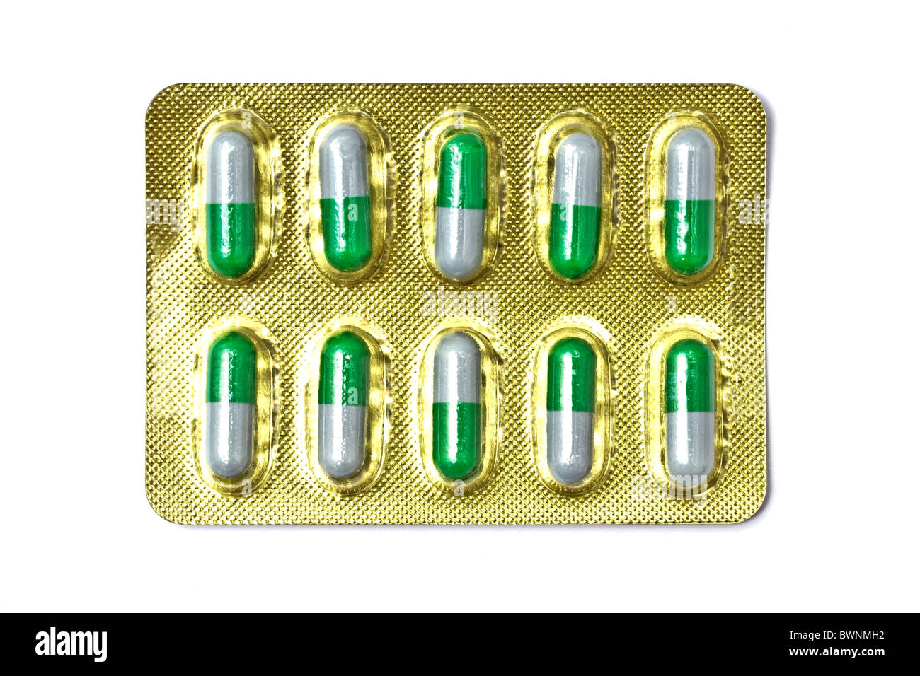 Green capsules packed in blister isolated on white Stock Photo - Alamy