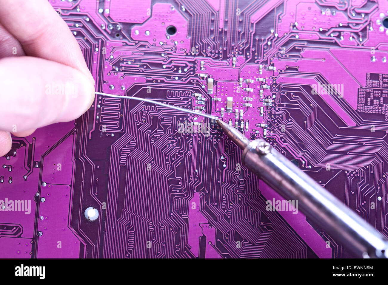 A close up shot of the backside of a computer circuit board, also known ...