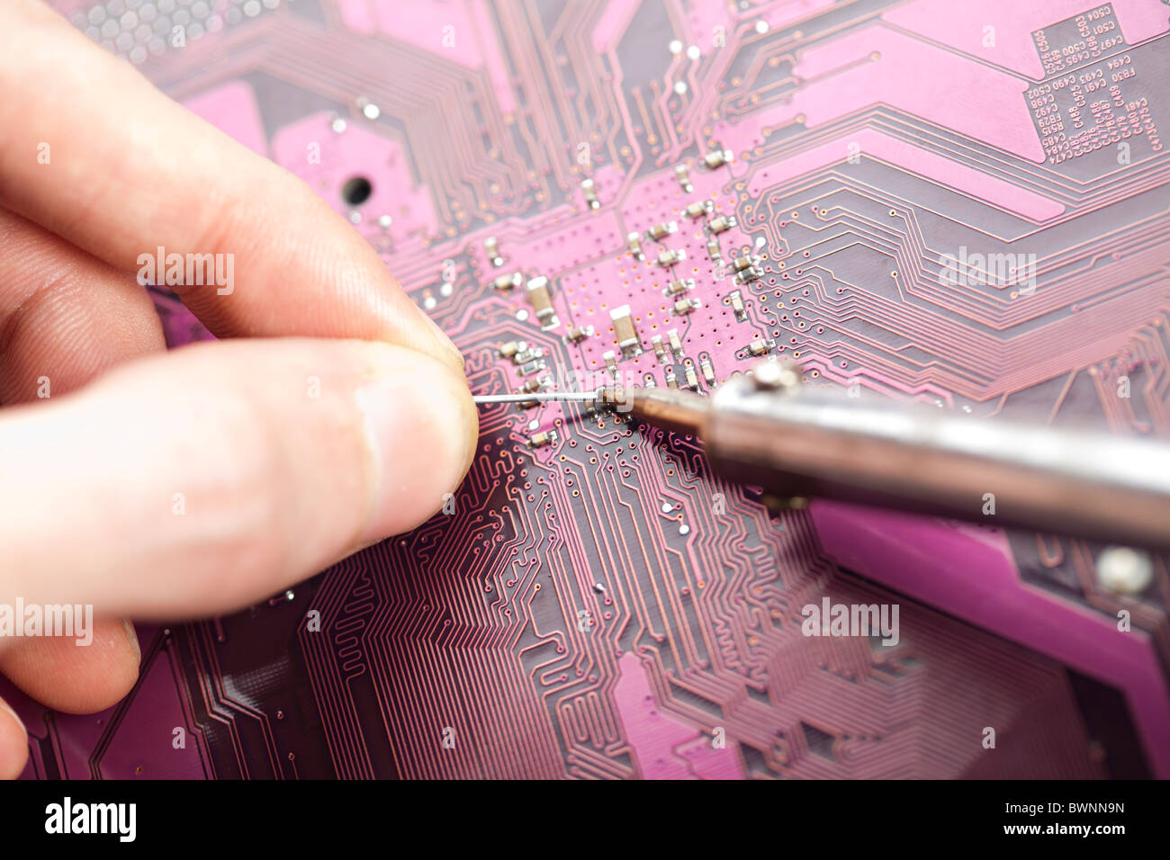 A close up shot of the backside of a computer circuit board, also known ...