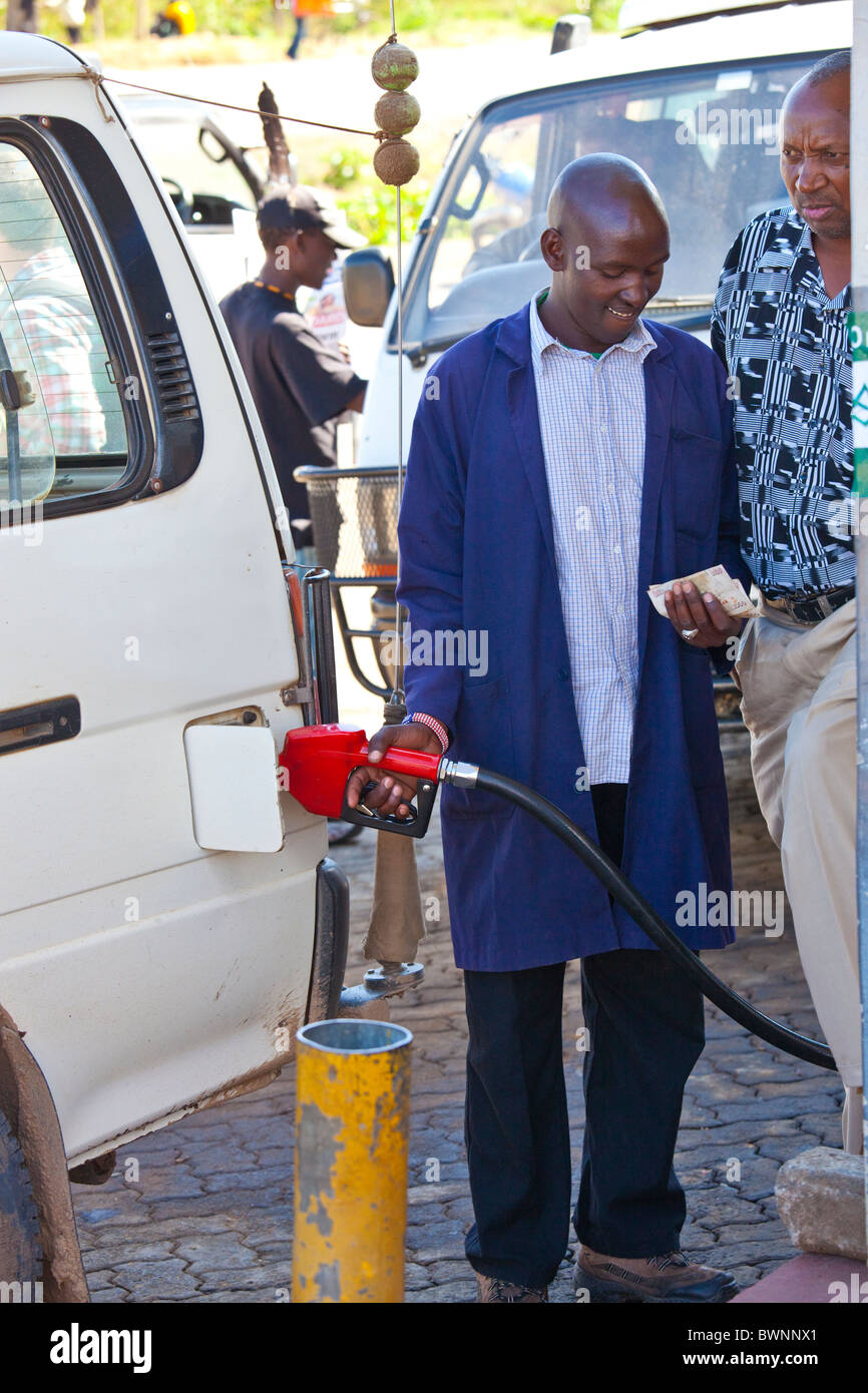 Safari vehicle filling at a gas station attendant in Narok, Kenya Stock ...