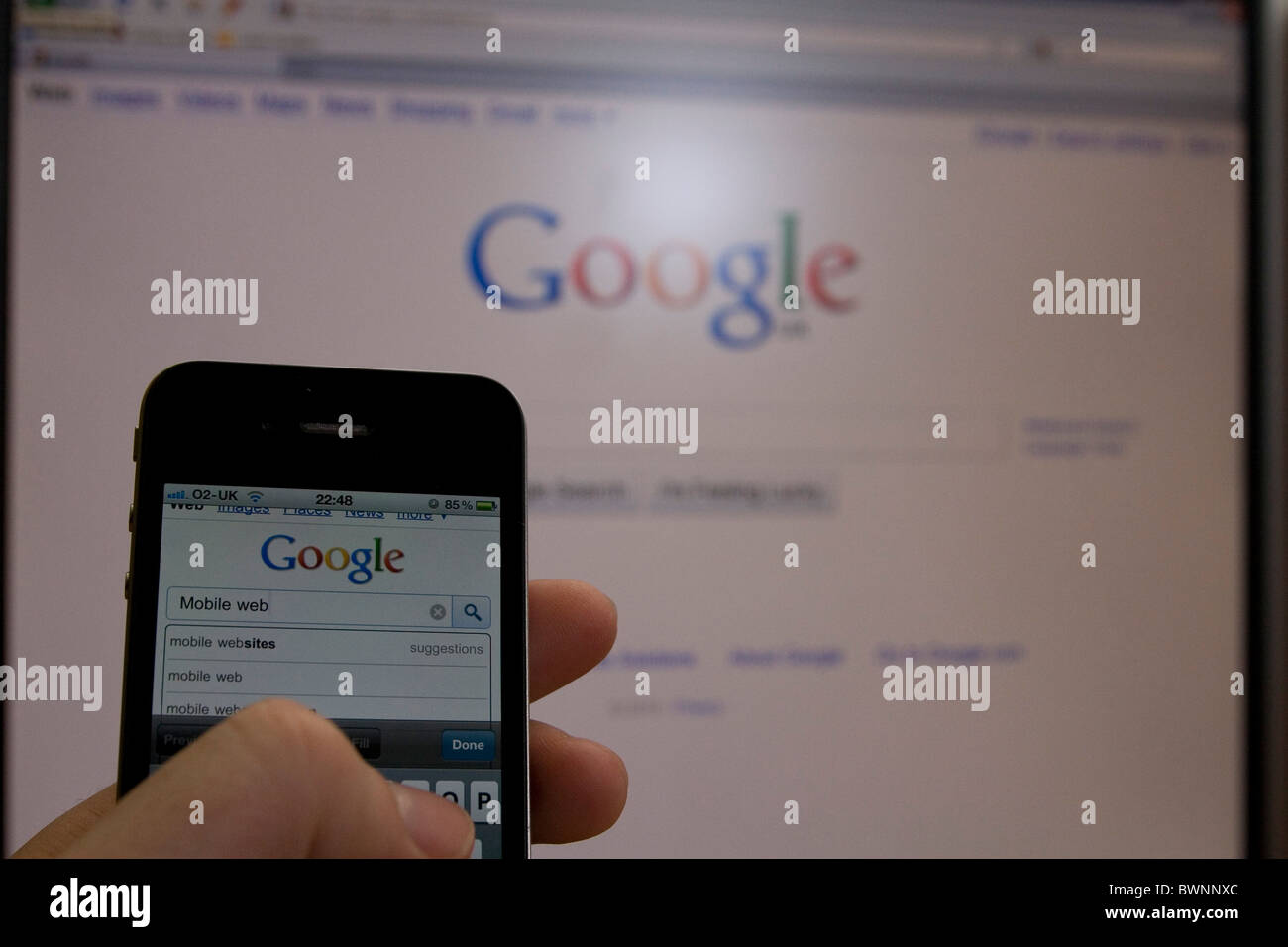 An Apple iPhone 4 mobile smart phone showing Google mobile with the ...