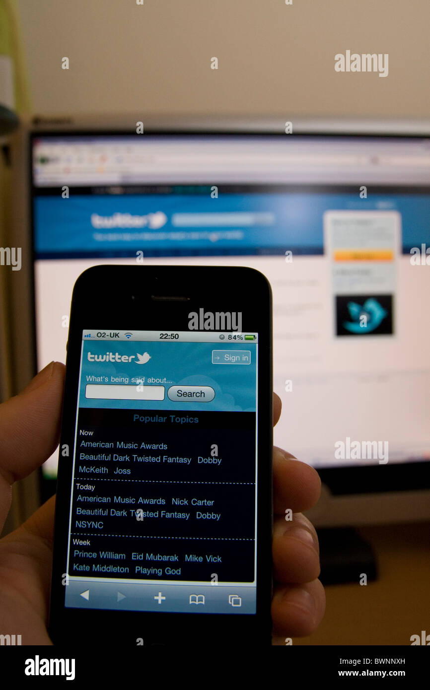 An AppleiPhone 4 mobile smart phone showing the social networking page ...