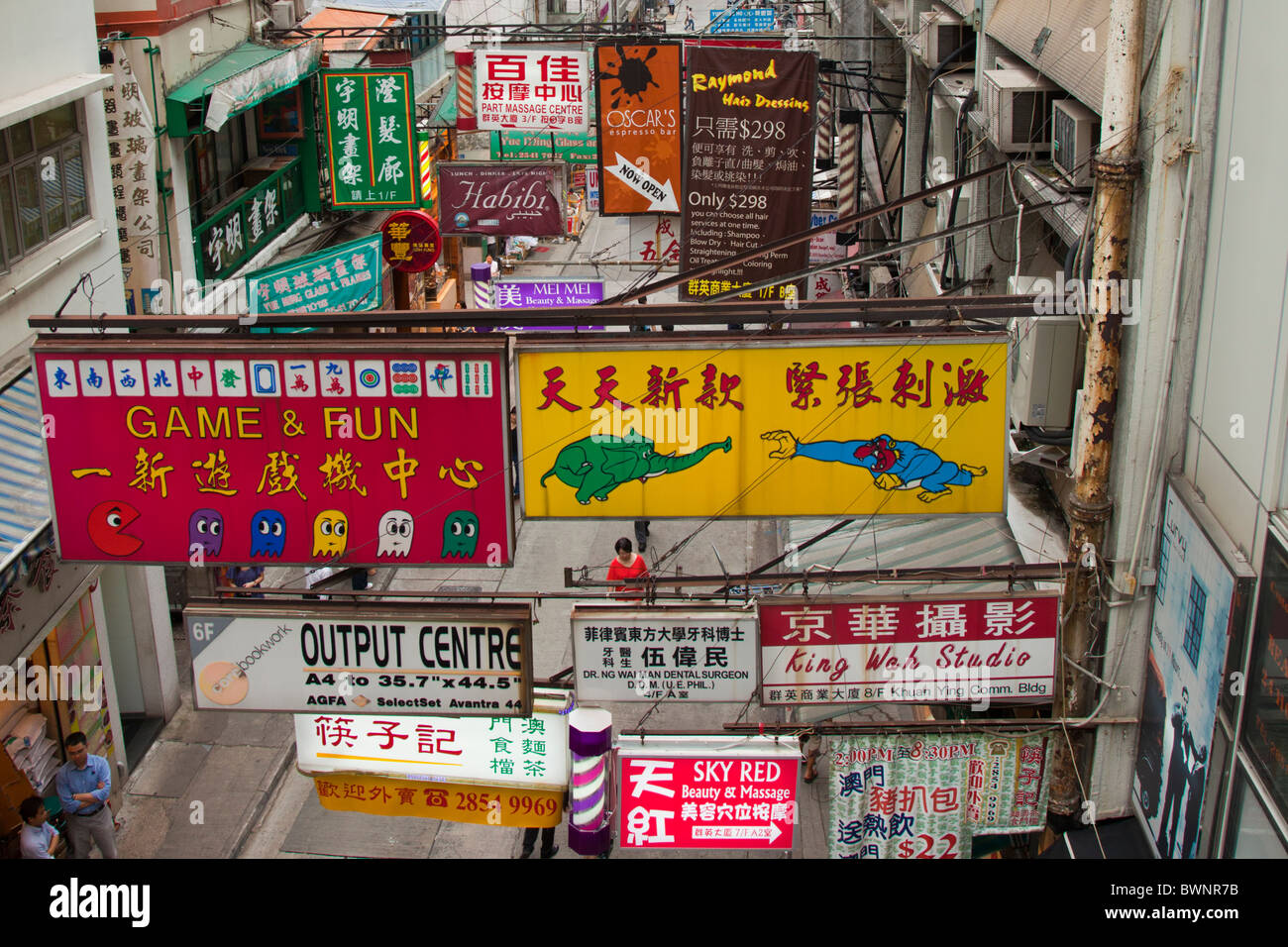 Typical street on Hong Kong island with all the huge shop signs ...