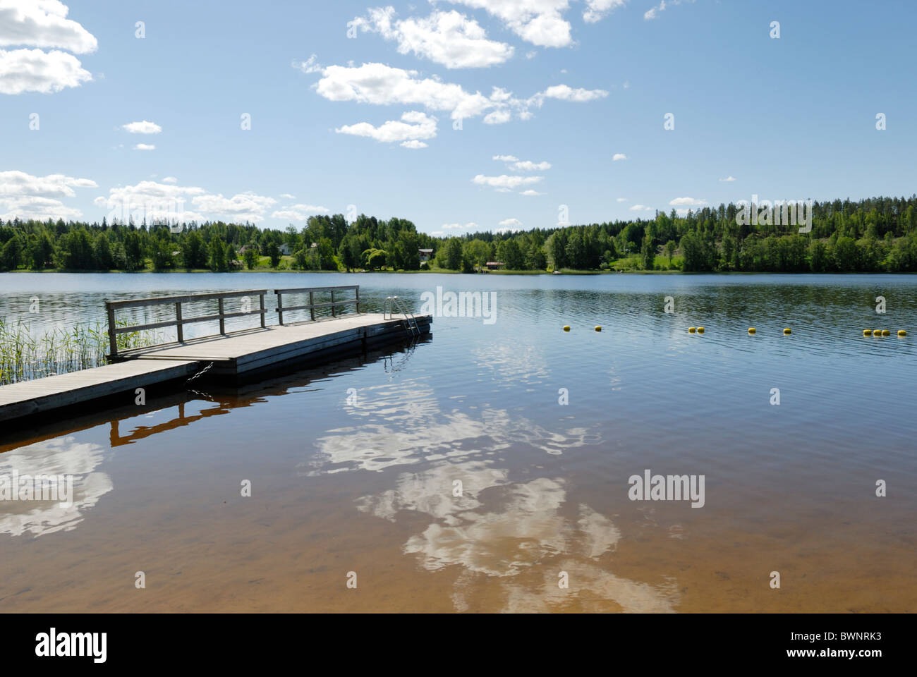 Lake and small beach Stock Photo - Alamy