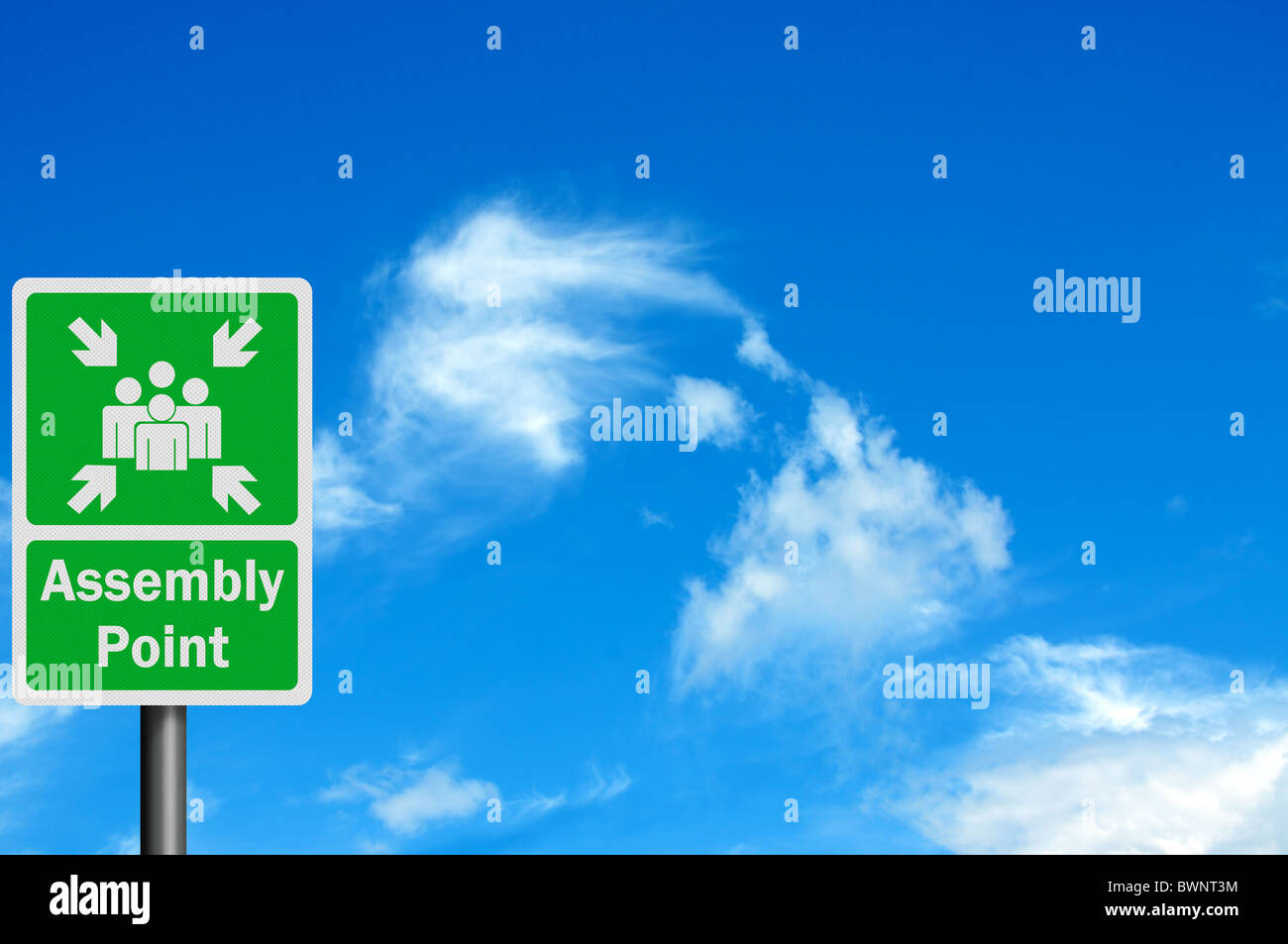 Green white assembly point sign hi-res stock photography and images - Alamy