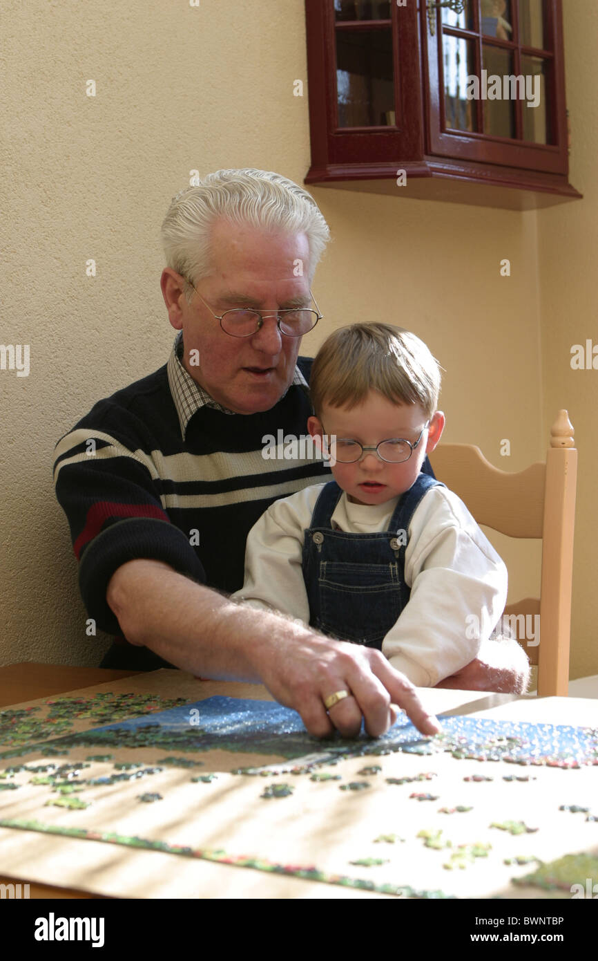 Grandparents look after child Stock Photo - Alamy