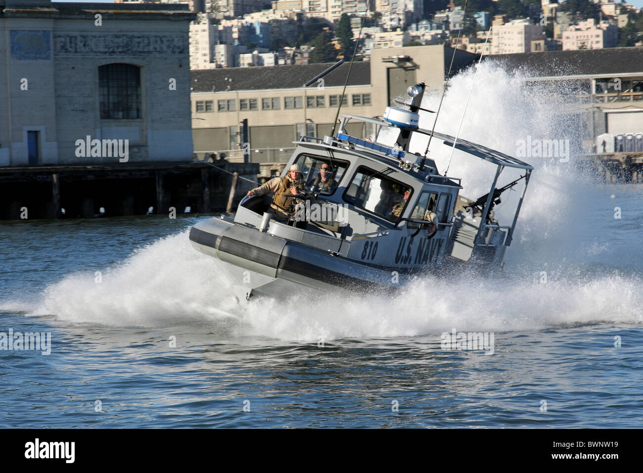 U.S. Navy Security forces patrol the San Francisco waterfront in the 34 ...