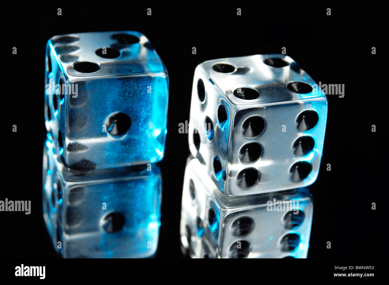 Pair of dice isolated on black background Stock Photo - Alamy