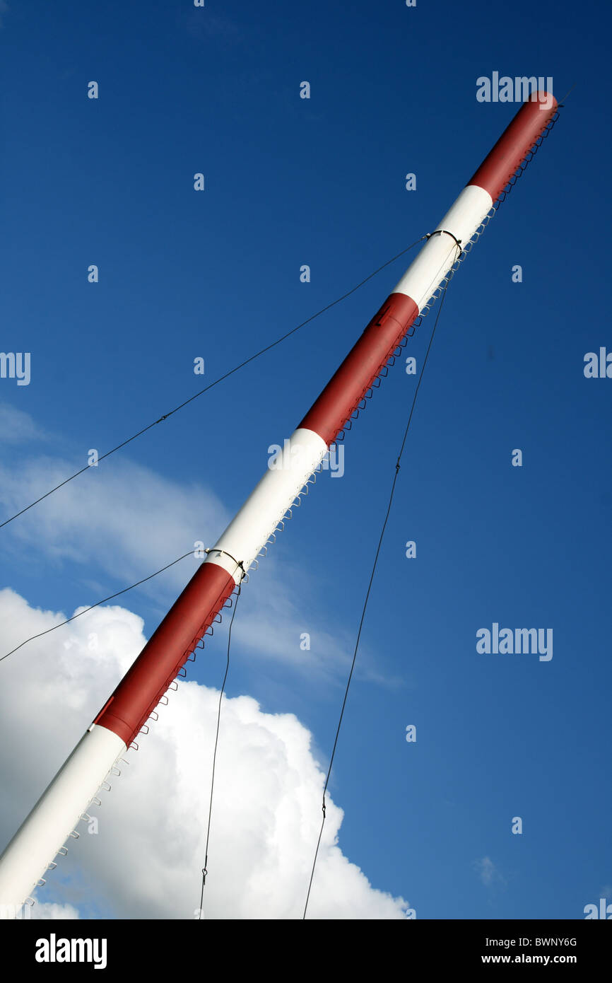 Red and white pipe boiler against the blue sky Stock Photo - Alamy