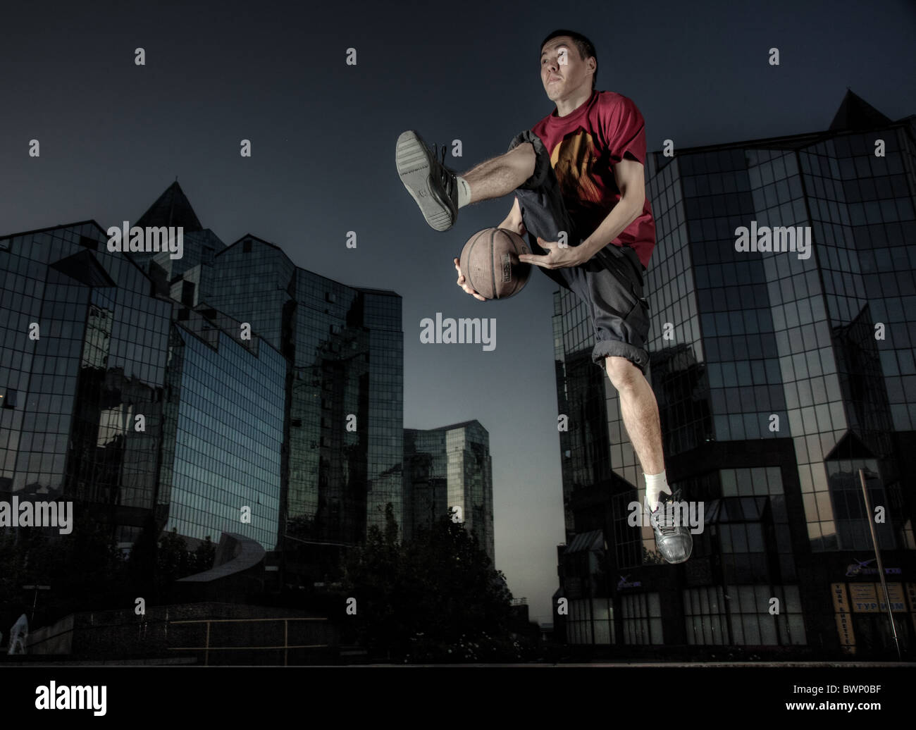 European man basketball player jump with the ball Stock Photo - Alamy