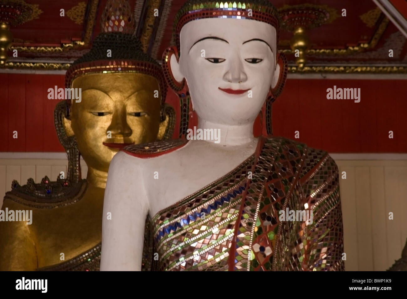Buddha statues are on display inside a beautiful and elaborate Buddhist ...