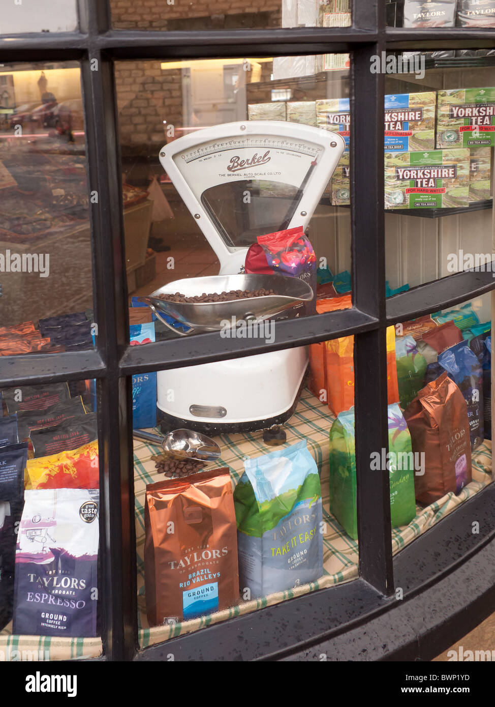 An old fashioned grocers shop window with a display of Yorkshire tea ...