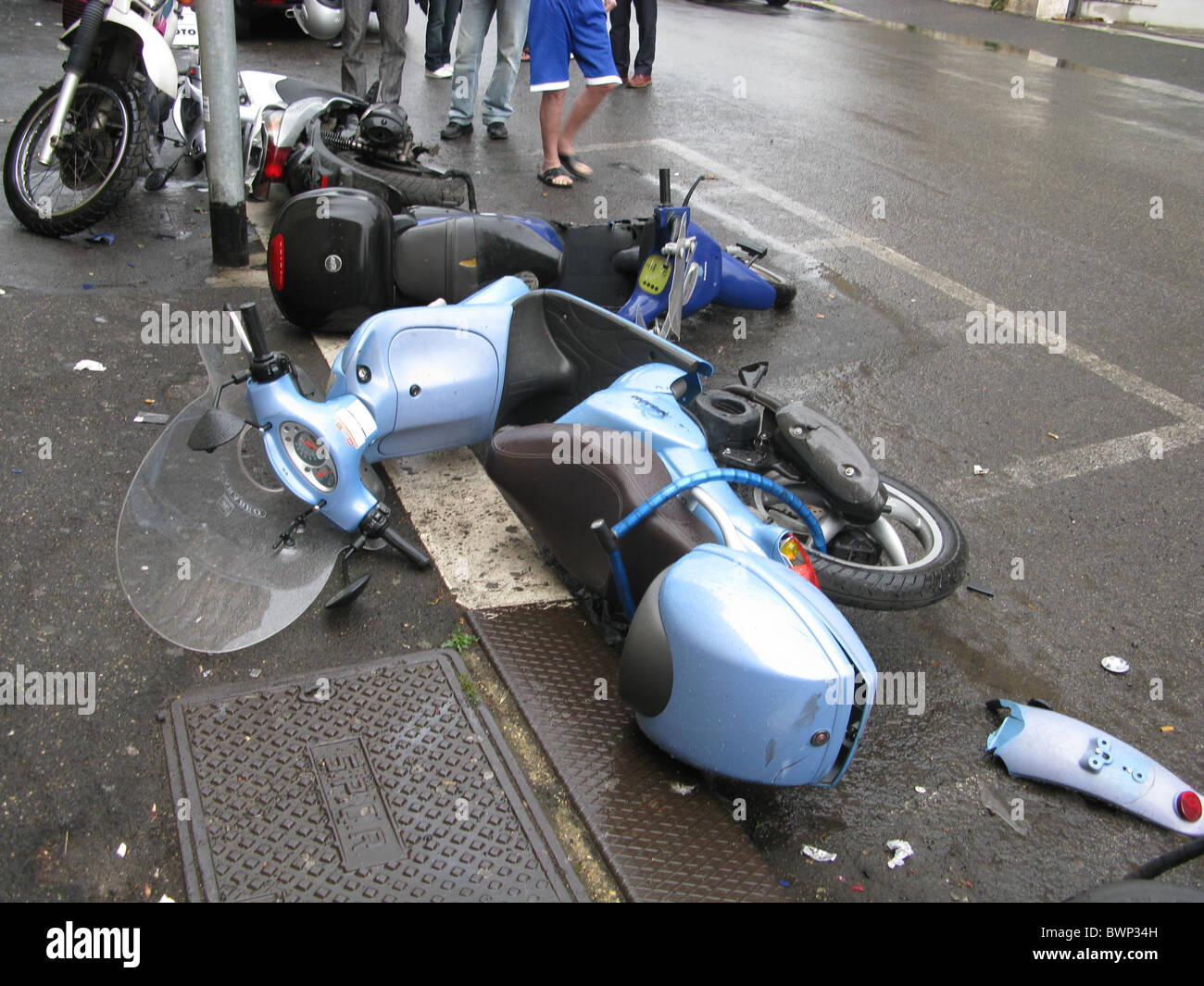 row of scooters damaged by a hit and run driver, rome Stock Photo - Alamy