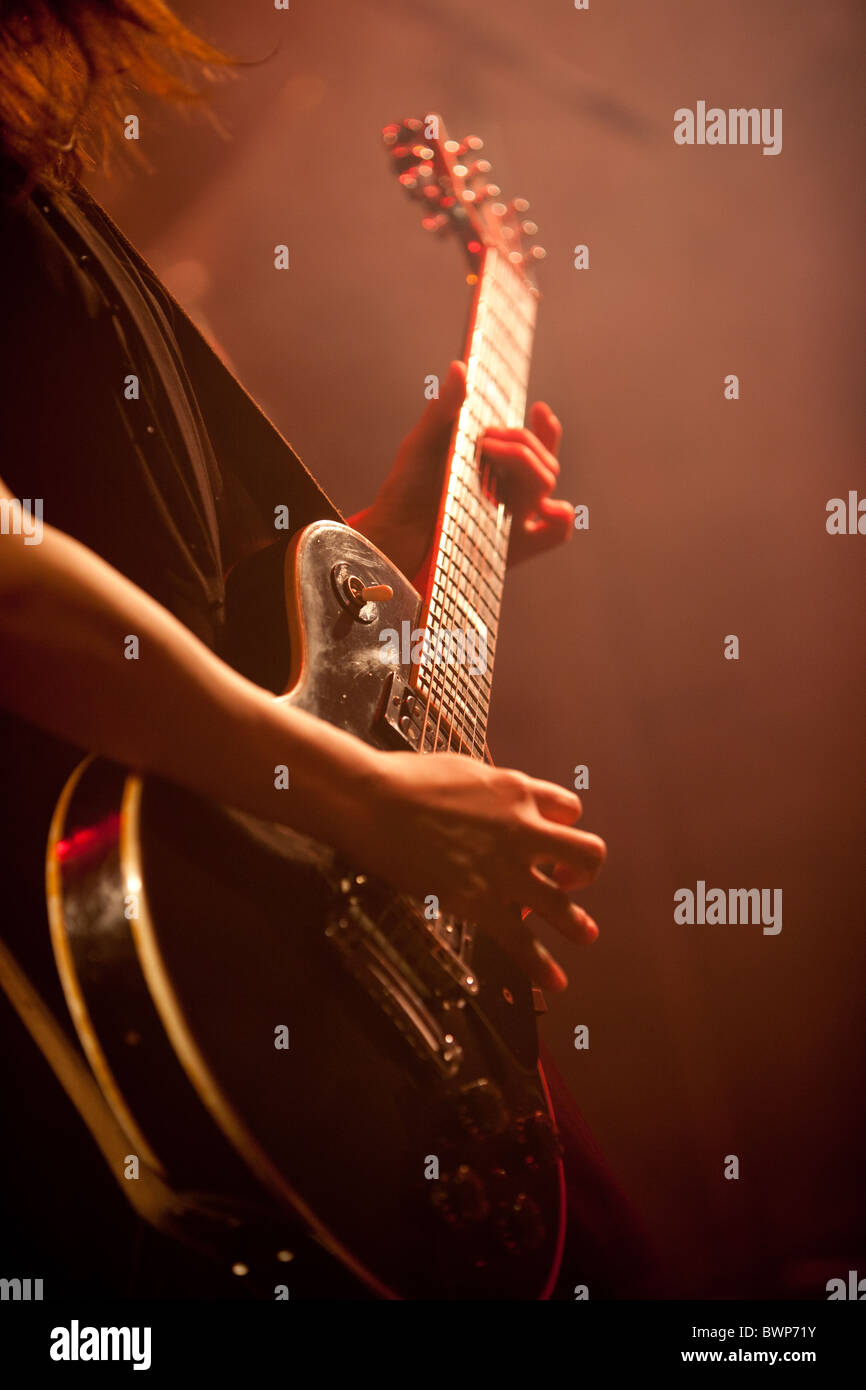 Guitarist on stage playing a live concert, with guitar Stock Photo - Alamy