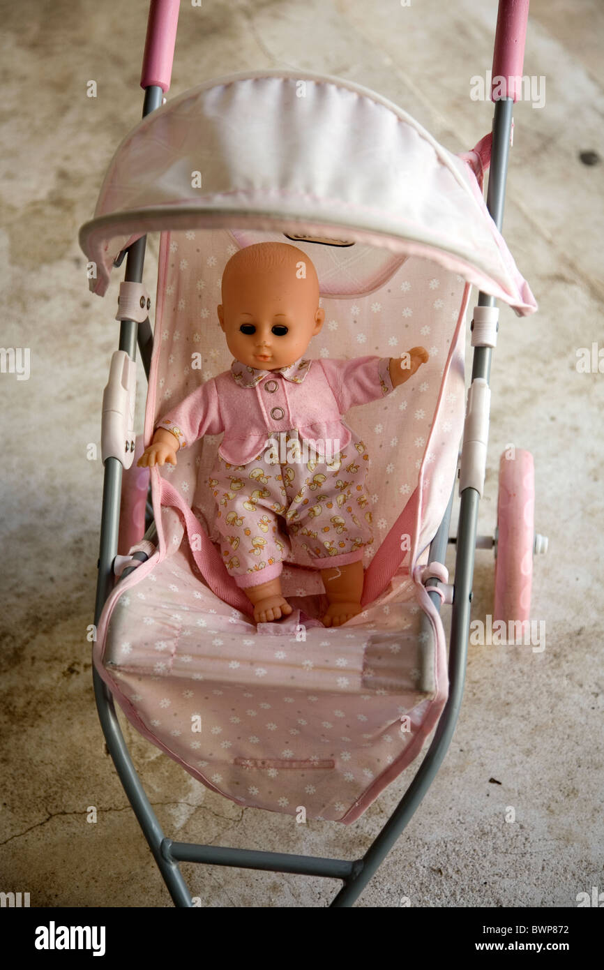 Poor girl with doll hi-res stock photography and images - Alamy