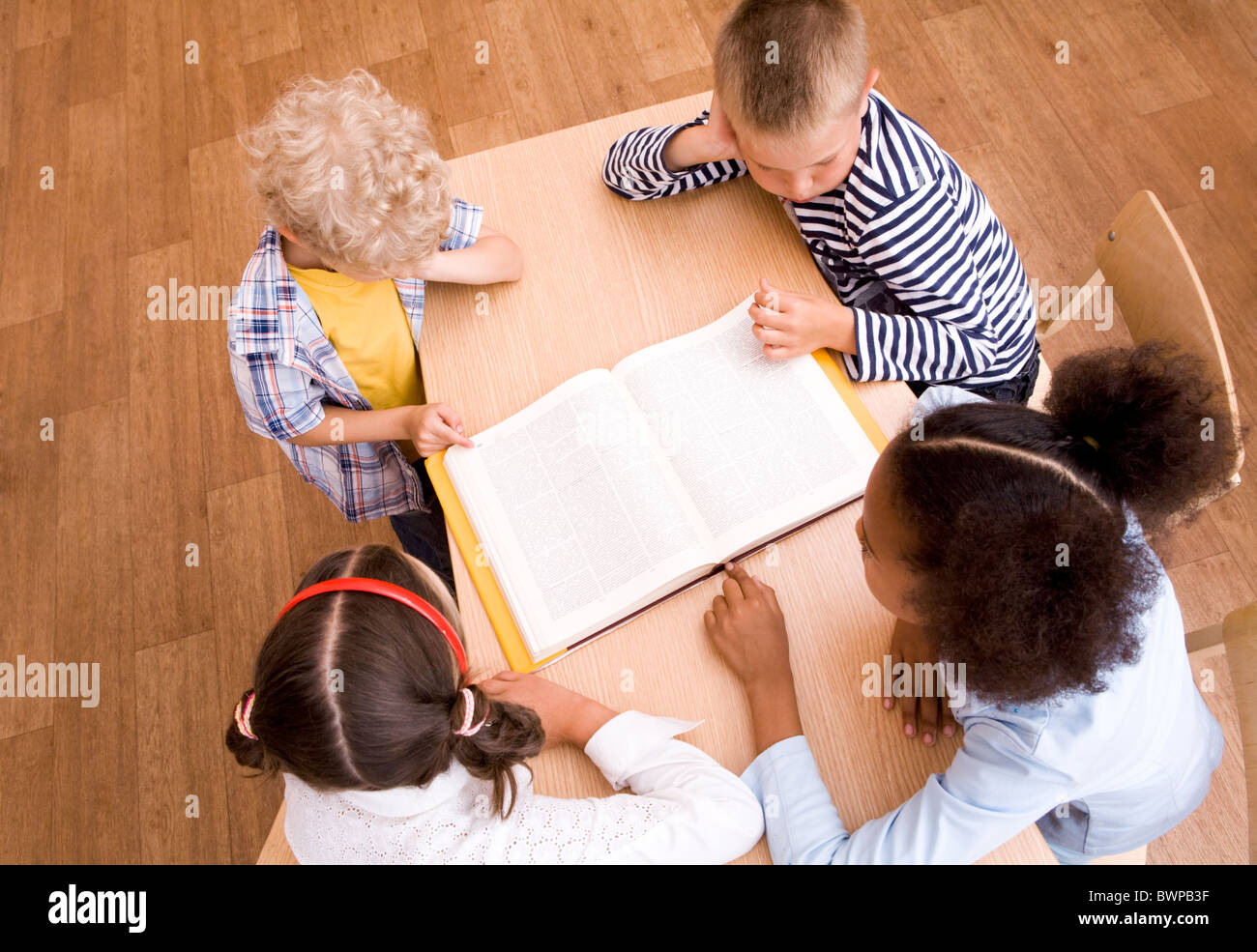 Child open book above desk hi-res stock photography and images - Alamy