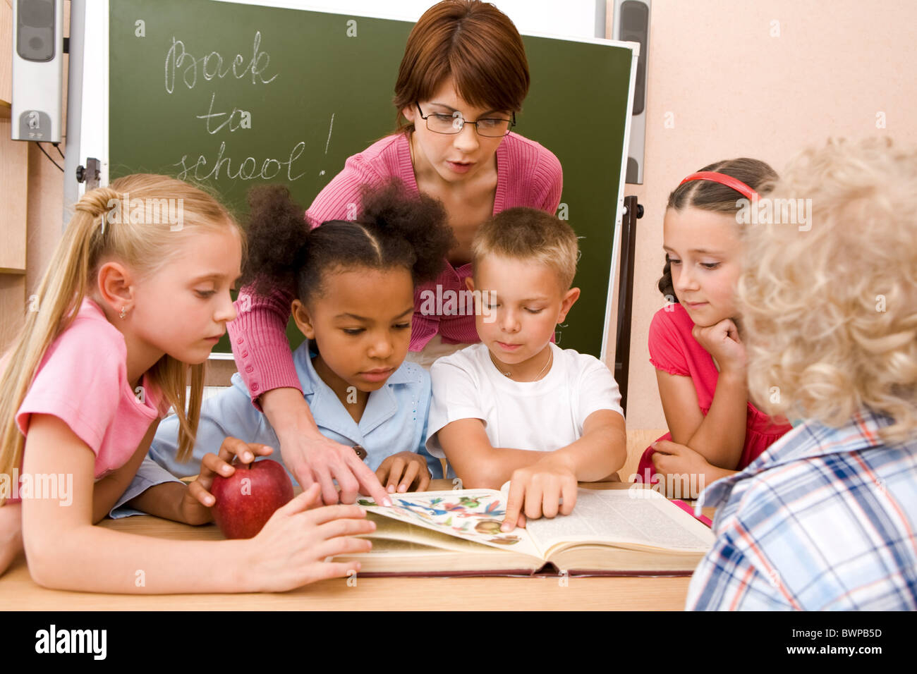African teacher showing book children hi-res stock photography and ...