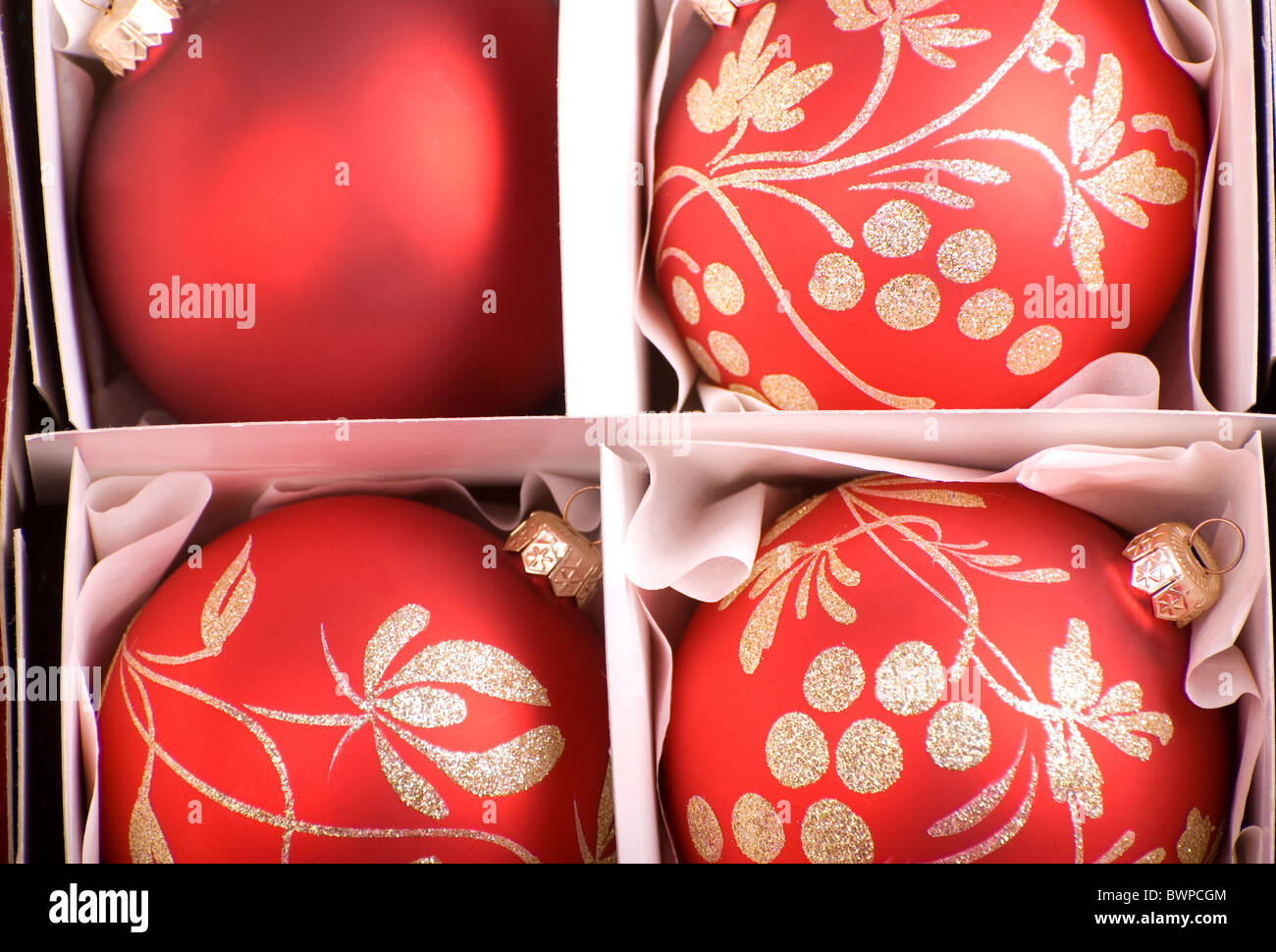 four glassballs packed in paper carton Stock Photo - Alamy