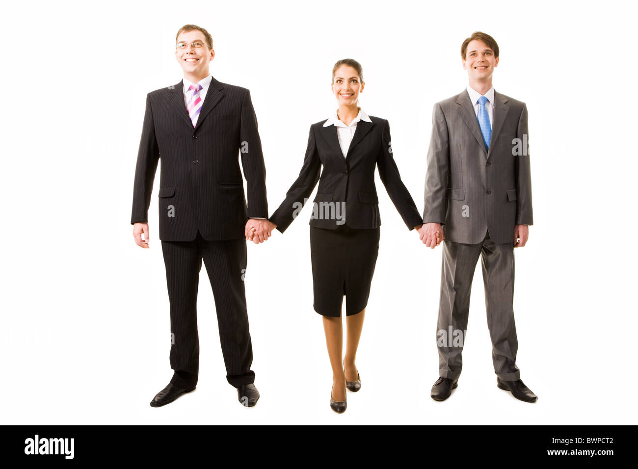 Team of three business people holding each other by hands Stock Photo ...